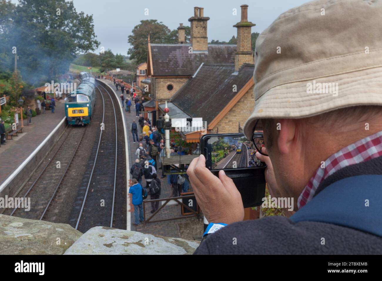 Rail enthusiast photographing class 52 'western' locomotive D1015 ...