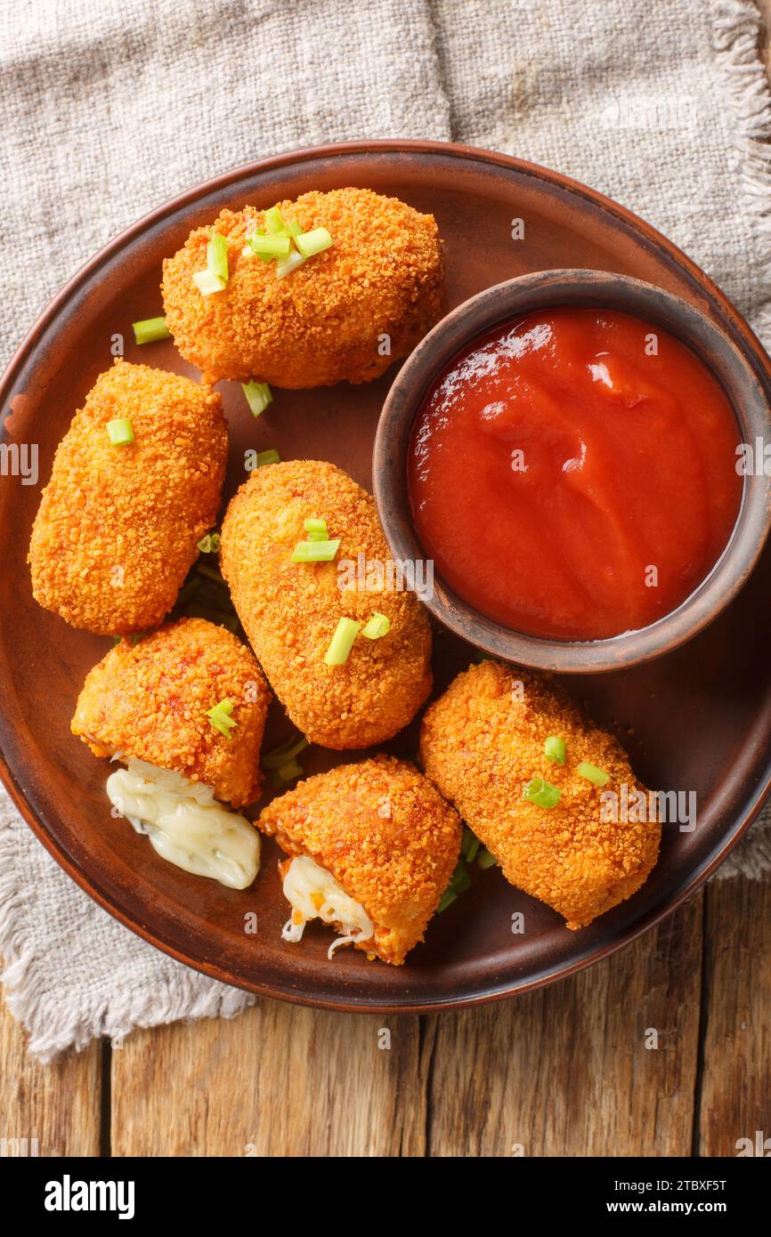 Fried rice balls stuffed with mozzarella suppli al telefono closeup on ...