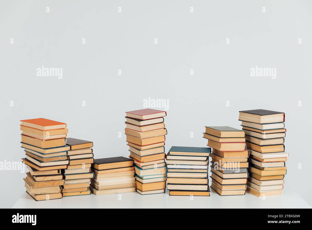 Stacks of old books in study library on white background Stock Photo ...