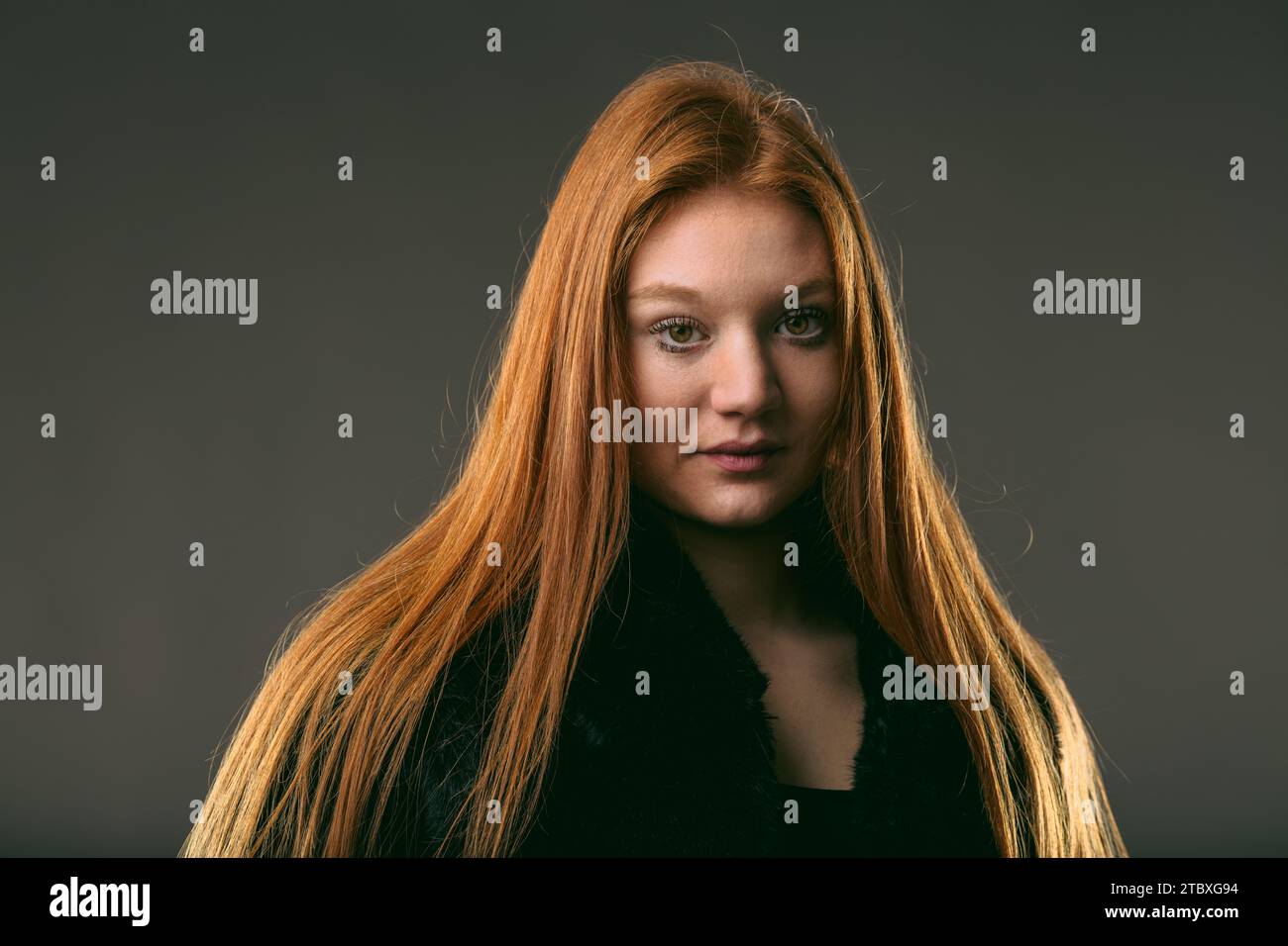 Portrait Of A Poised Young Woman With Striking Auburn Hair Exuding