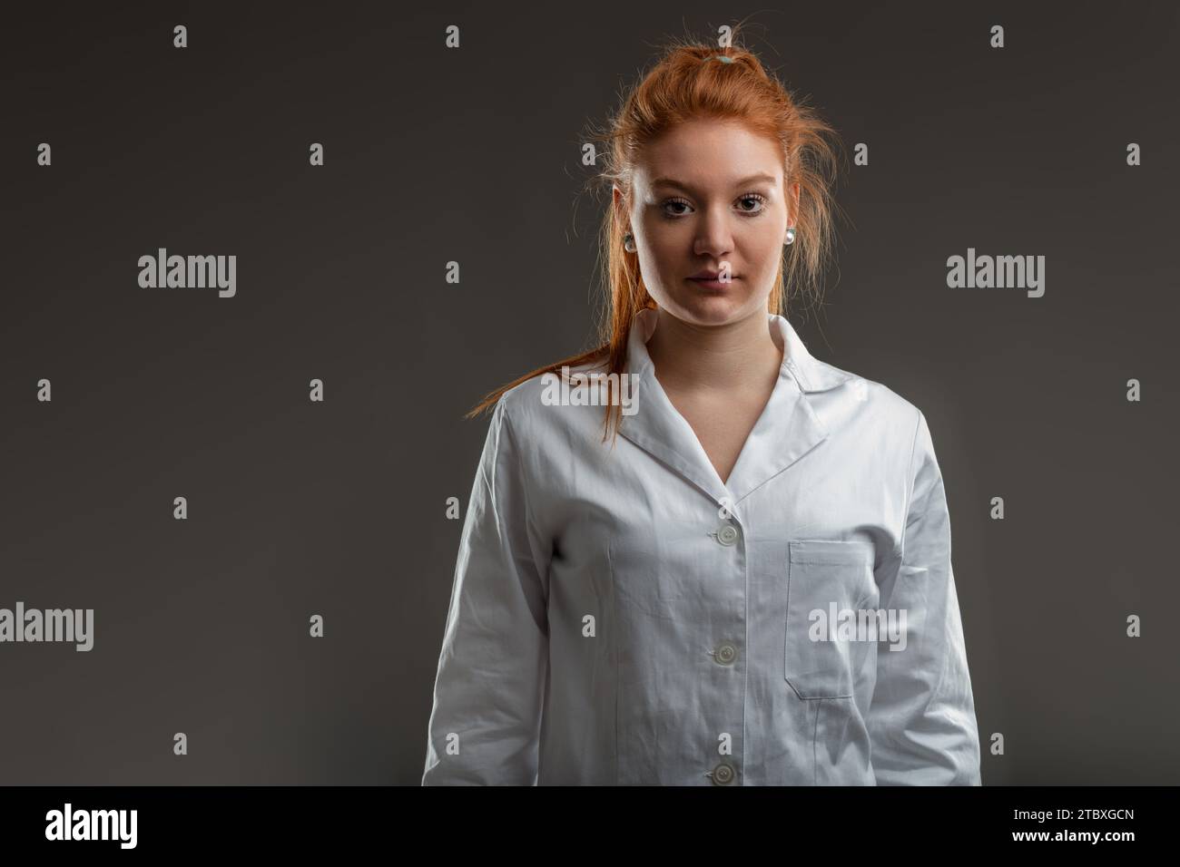scientist with a vibrant red mane dons the white coat, symbolizing a ...