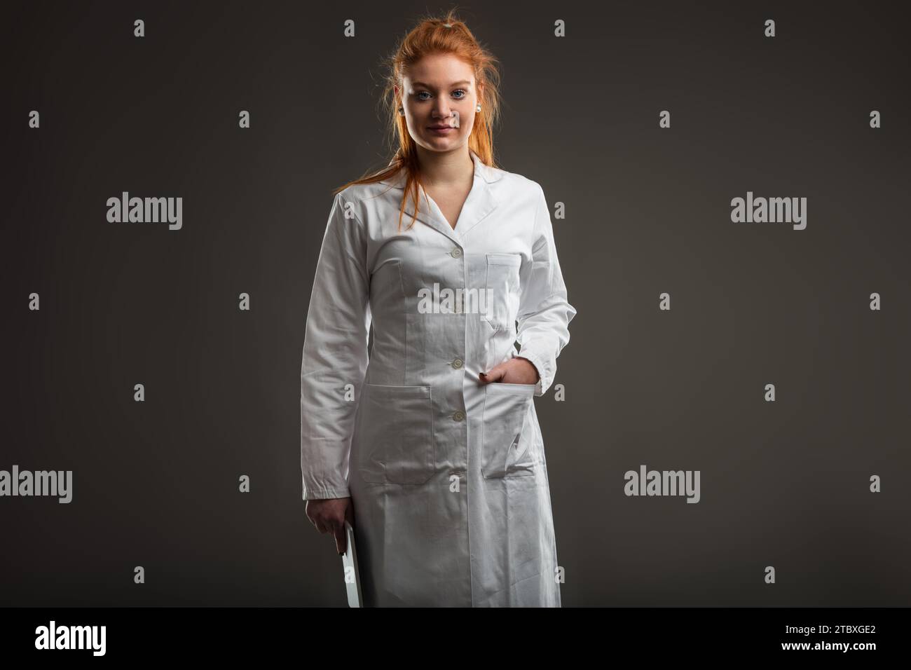 Young medical staff member, her red hair denoting her distinct presence ...