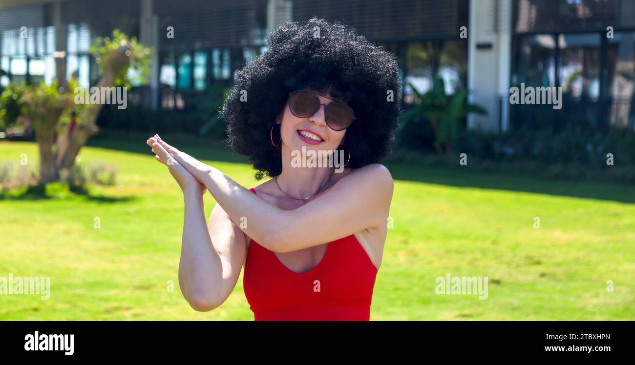 A girl claps her hands showing movements morning exercises Stock Photo ...