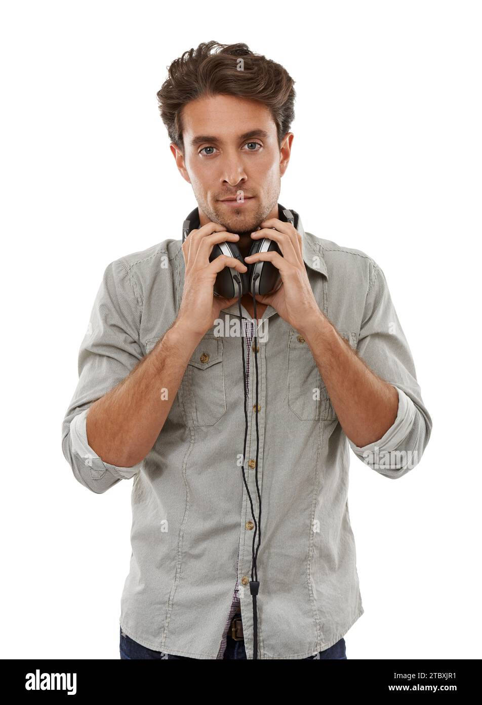 Man, portrait and headphones around neck in studio for audio ...