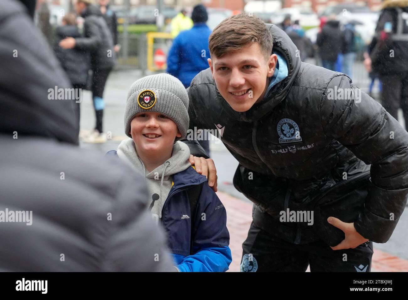 Harry Leonard #20 of Blackburn Rovers poses for a photo with a fan ...