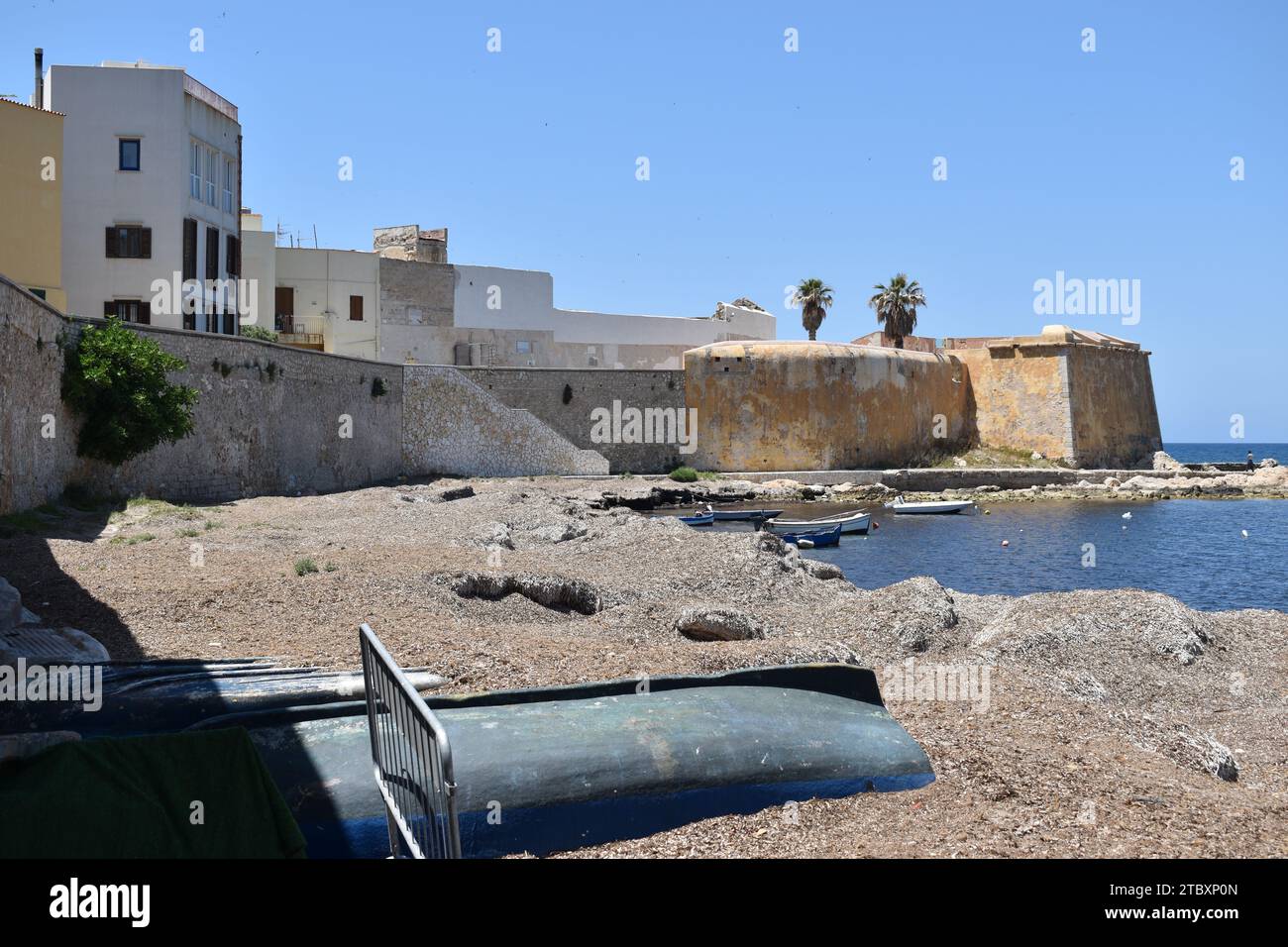 Stone wall and fortress at the Spiaga delle Mura di Tramontana with ...