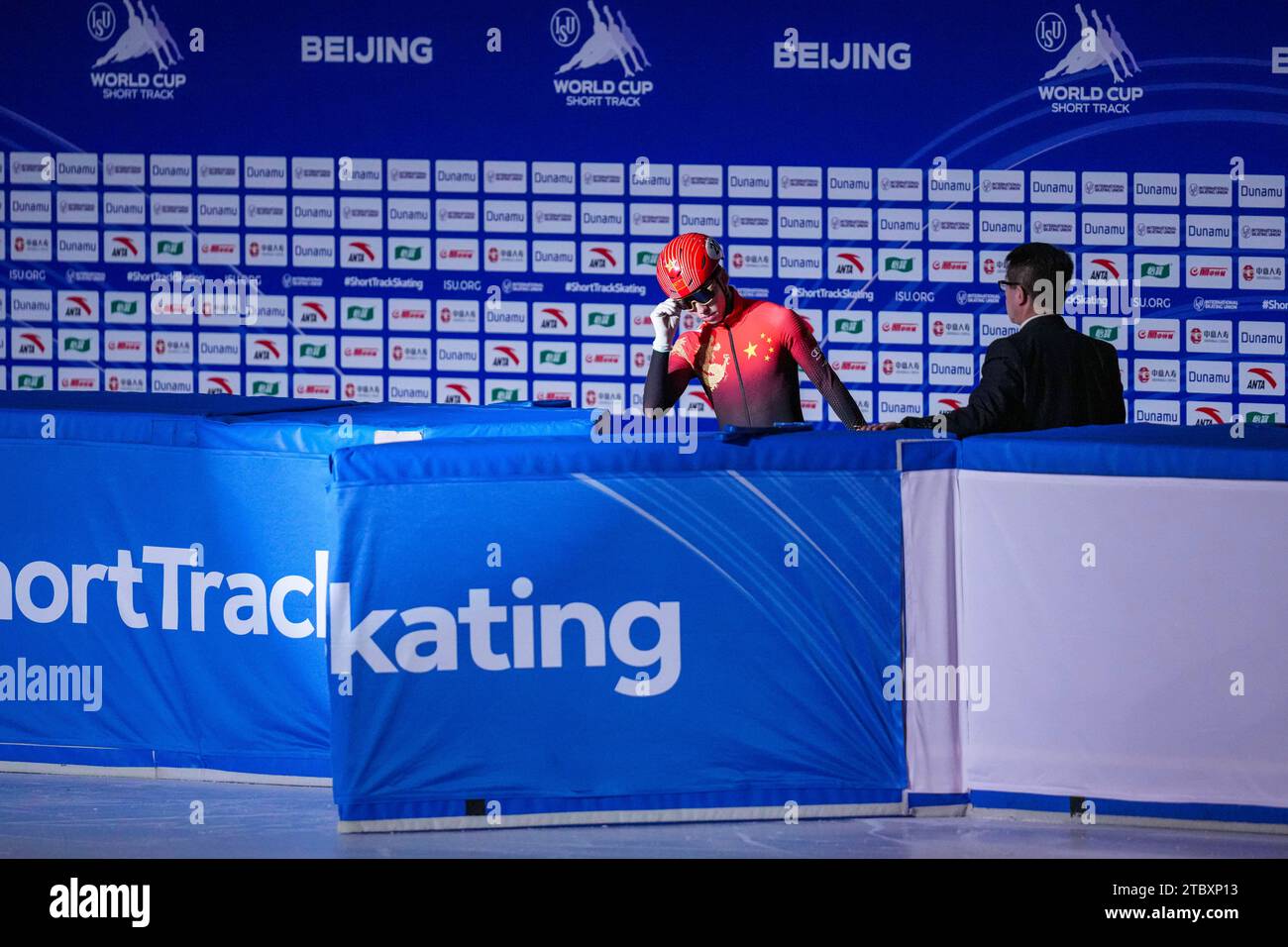 Beijing, China. 9th Dec, 2023. Lin Xiaojun (L) of China enters the rink ...