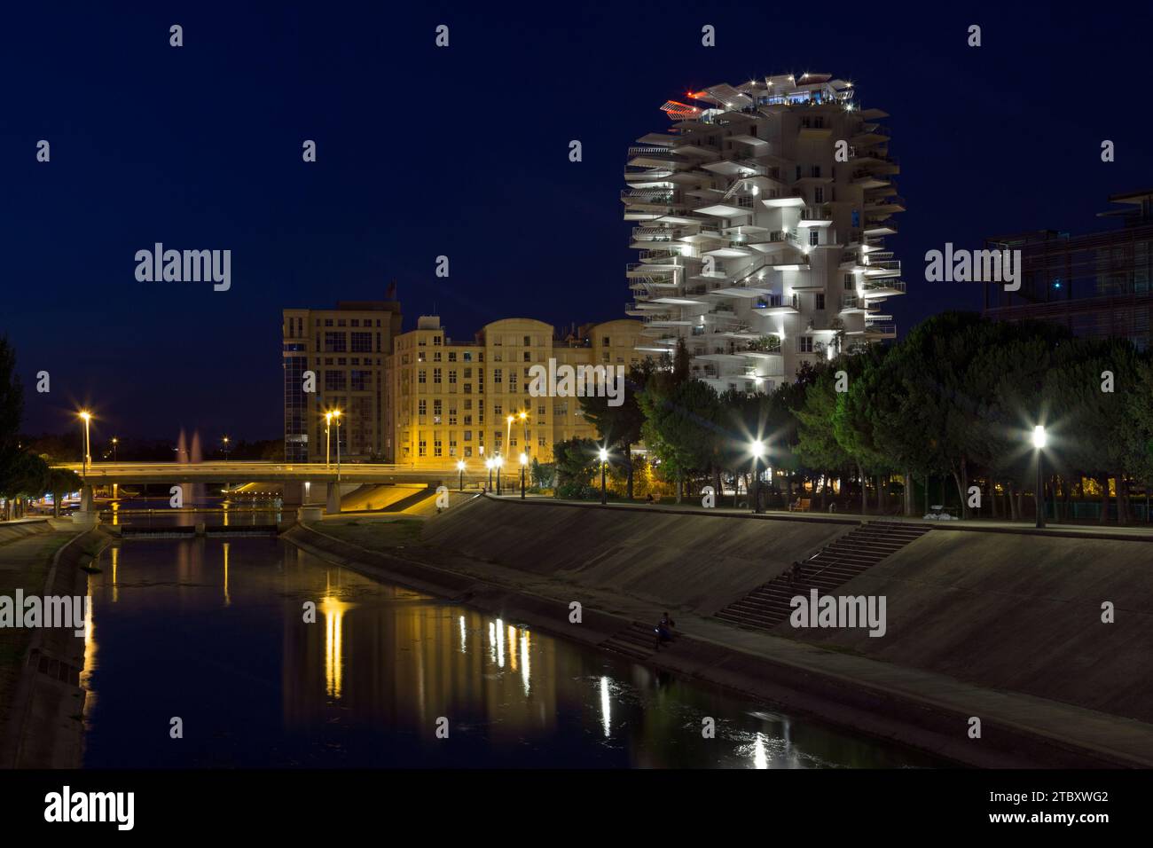 Modern building "L'Arbre Blanc" by night. Les Berges du Lez ...
