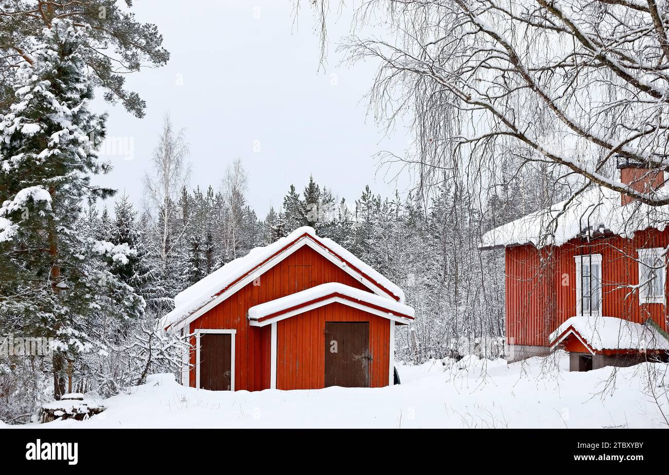 Red houses in the middle of winter wonderland Stock Photo - Alamy