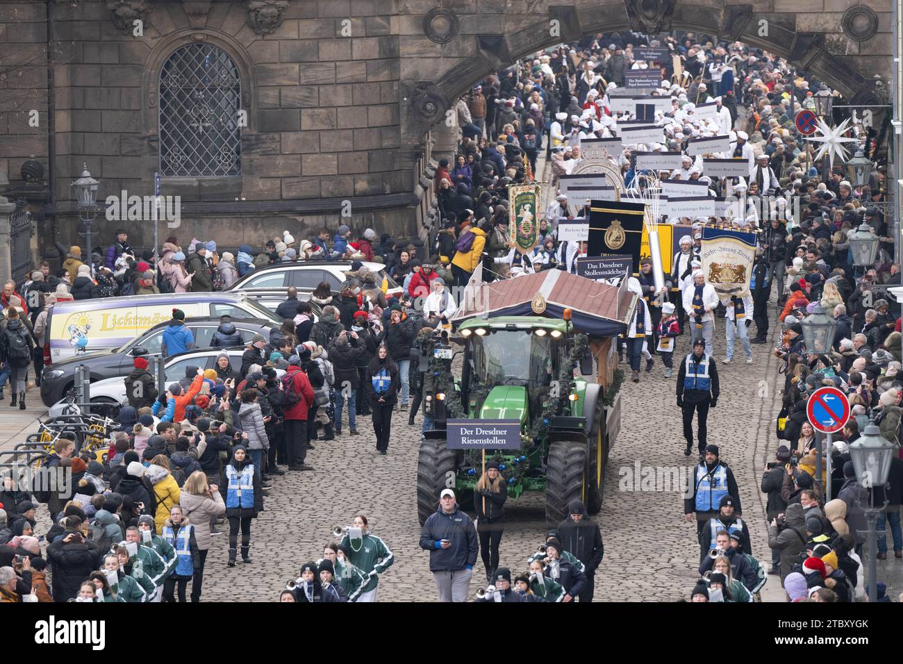 Dresden, Germany. 09th Dec, 2023. Participants in the Dresden Stollen Festival parade walk ...