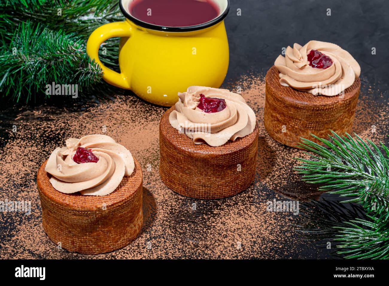 Cakes filled with cream and cherry jam. Box eclairs. New Year and ...