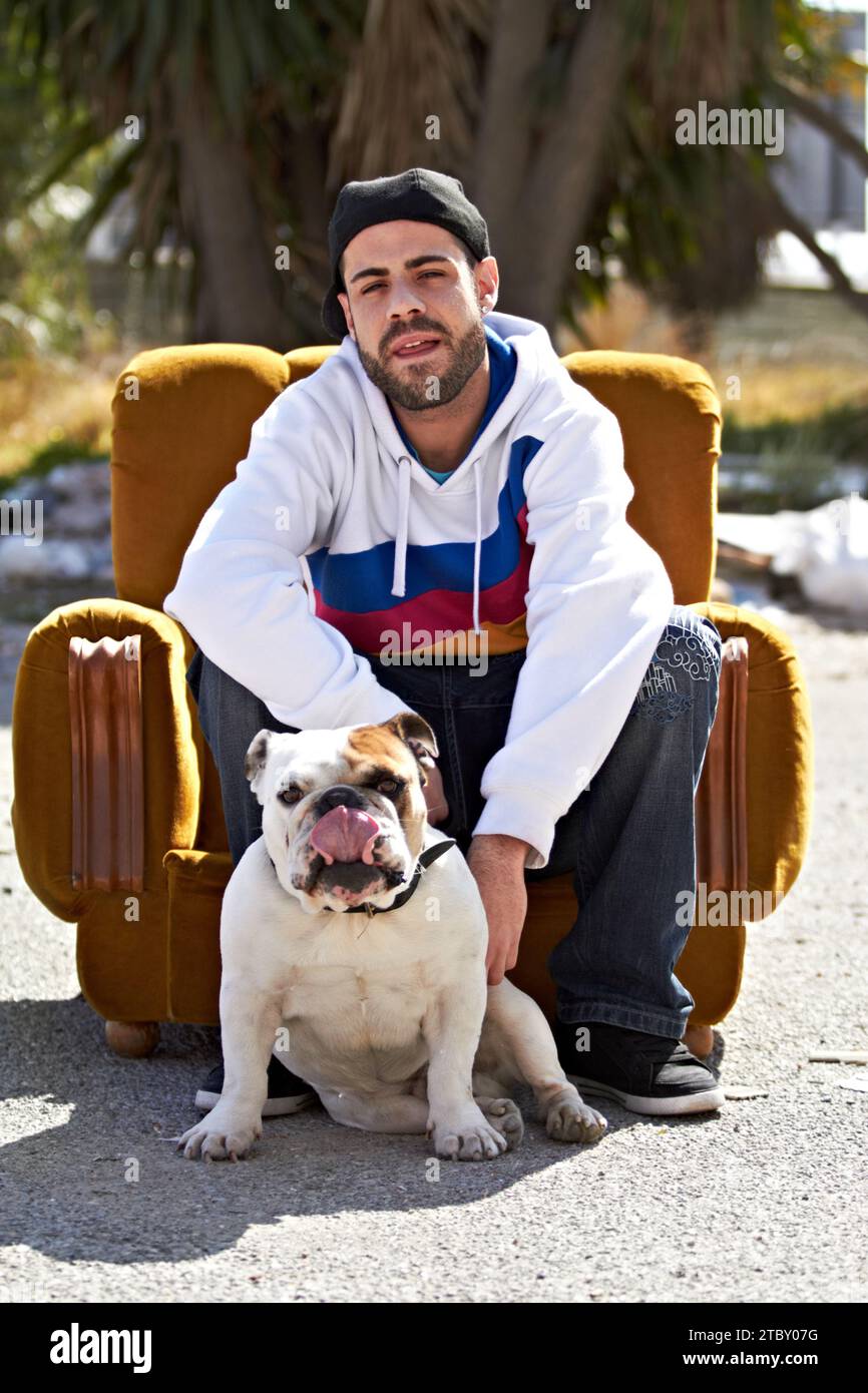 Couch, city and portrait of man with dog in street for urban fashion ...