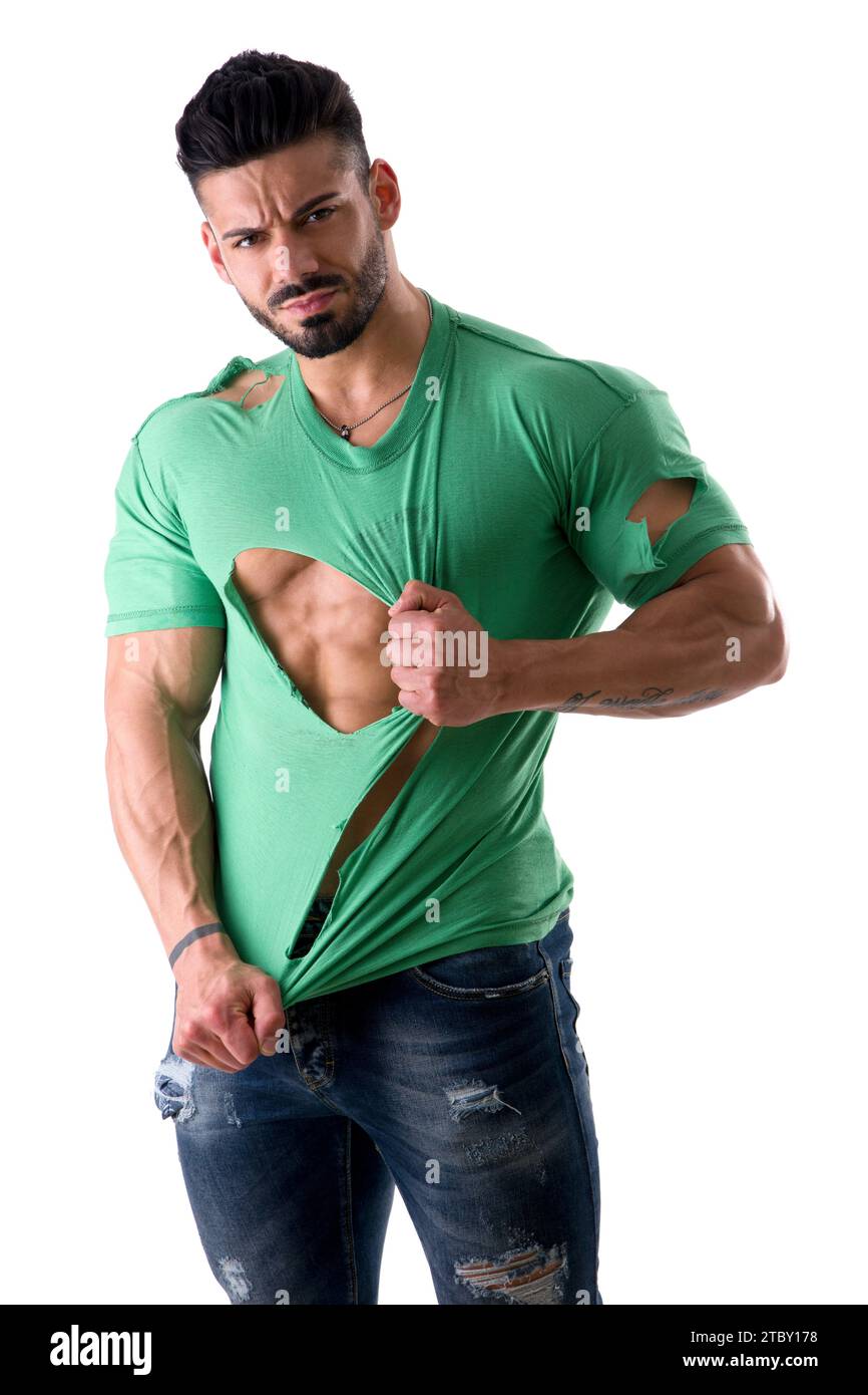 Attractive muscular strong man in ripped t shirt, isolated on white ...