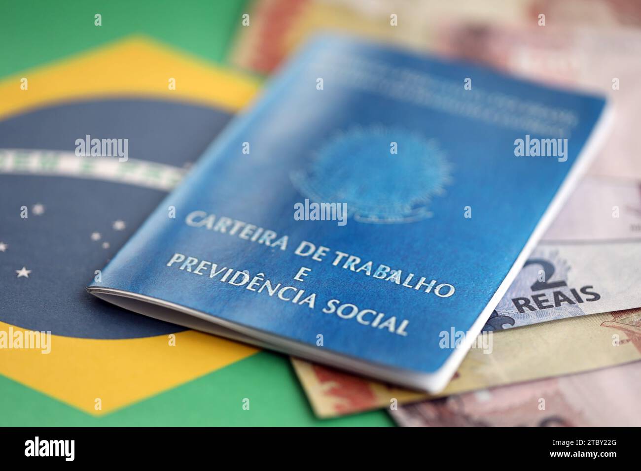 Brazilian work card and social security blue book and reais money bills ...