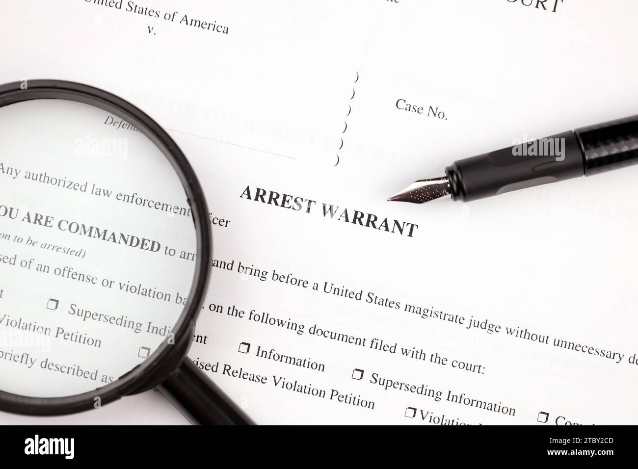 District Court Arrest Warrant court papers on A4 tablet lies on office ...