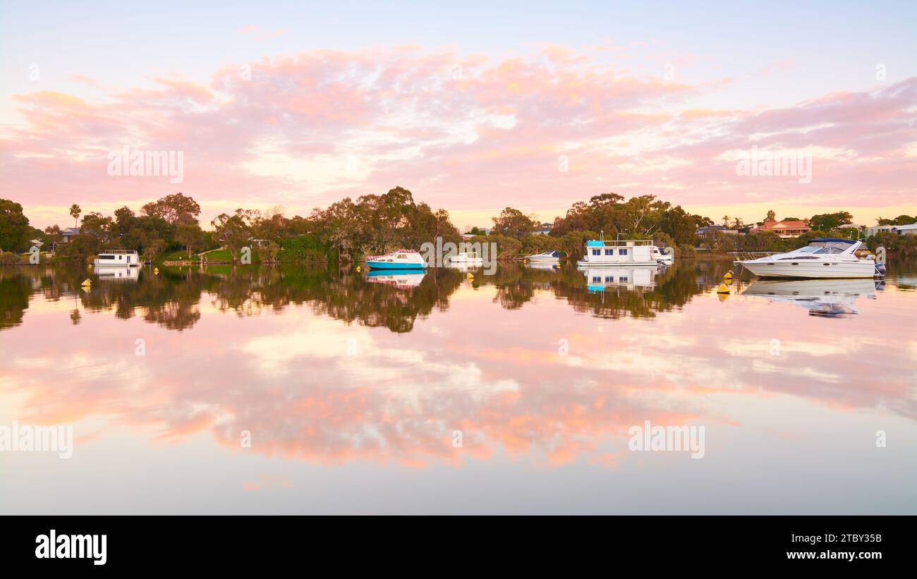 Boats and houseboats at sunrise on Bull Creek, a tributary of the ...