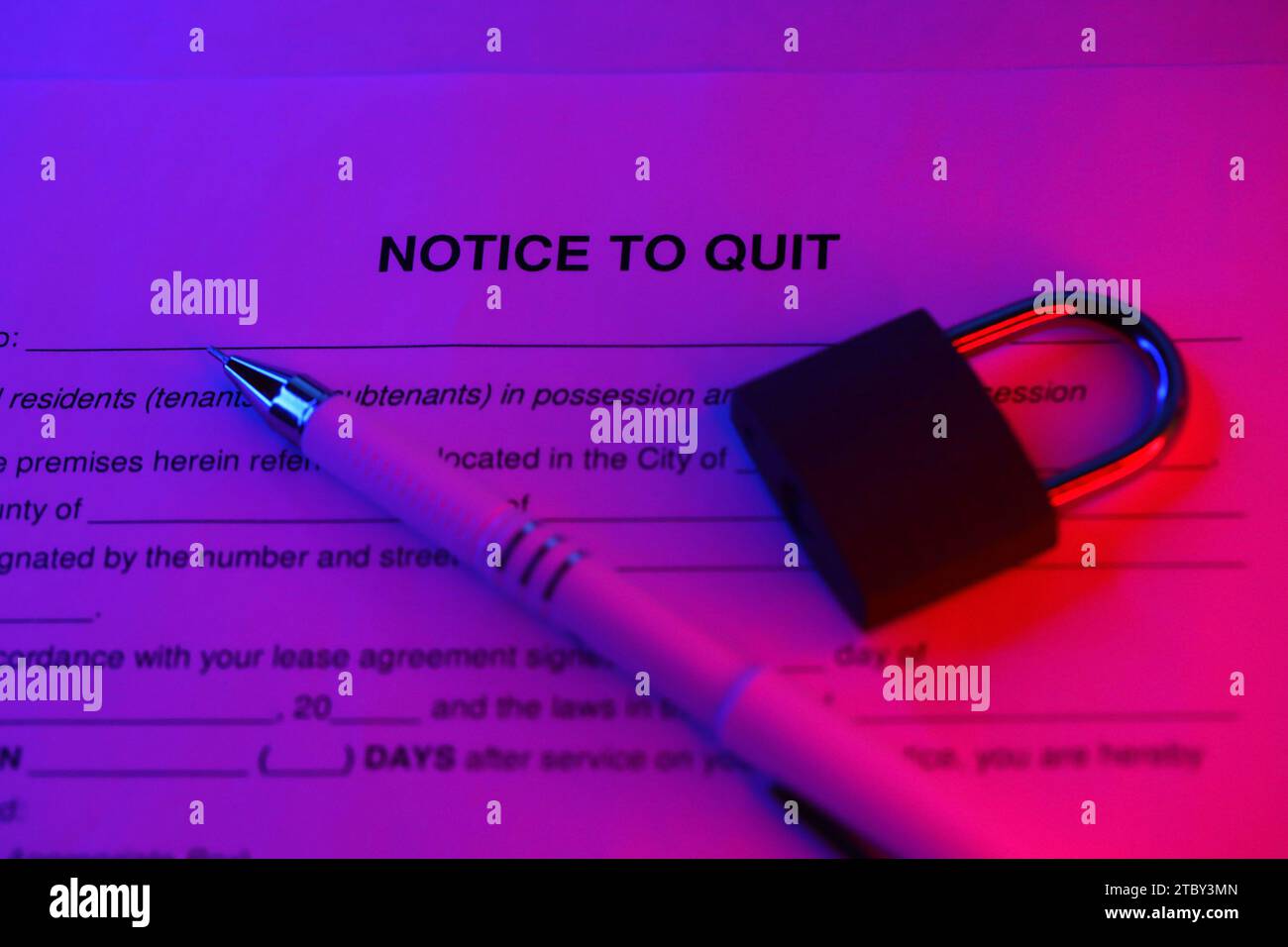 Notice to quit blank form with pen and small padlock on office table ...