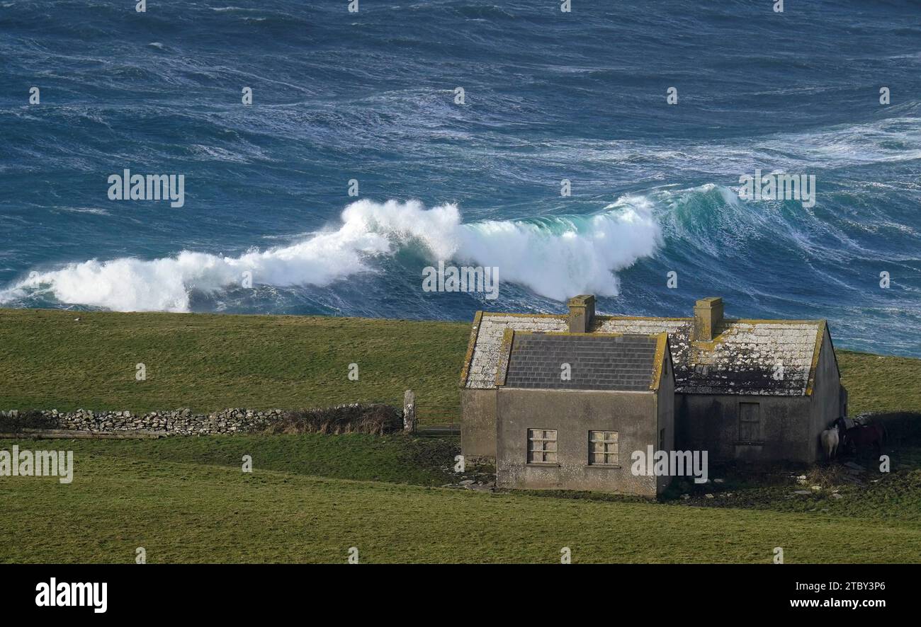 Waves crashing against the shore at Doolin in County Clare on the west ...