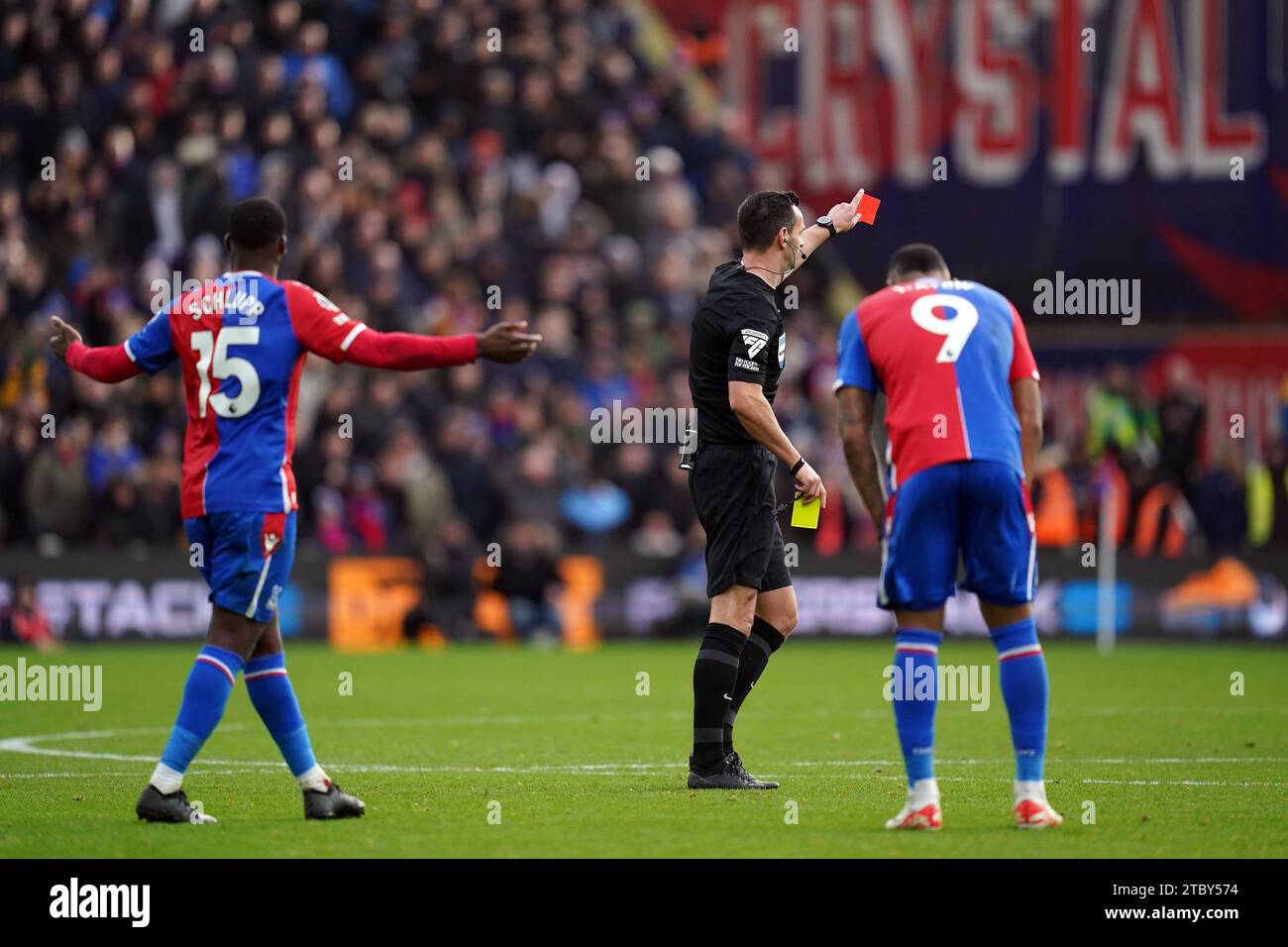 Referee Andrew Madley shows a red card to Crystal Palace's Jordan Ayew ...