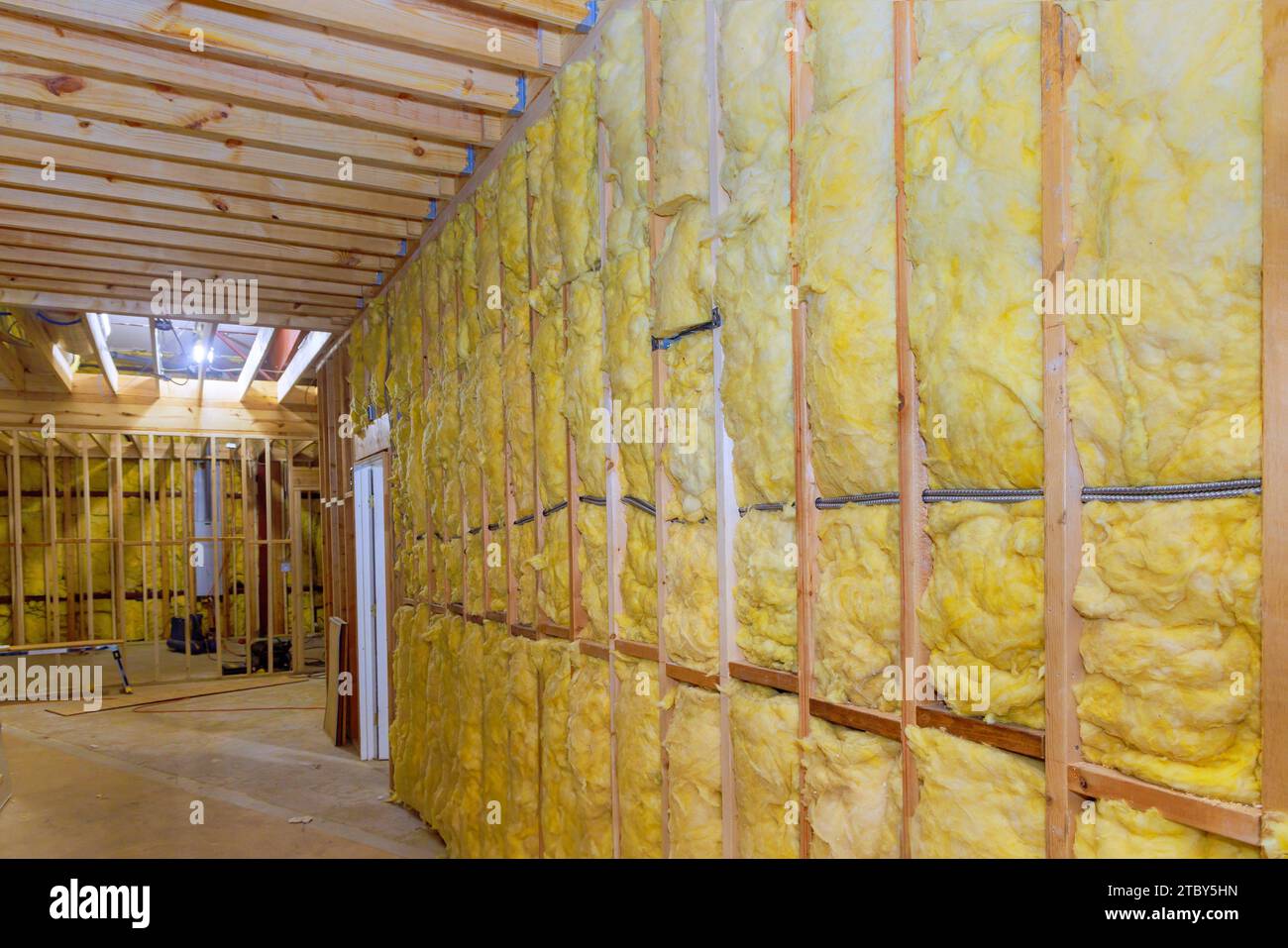 Thermal fiberglass insulation mineral rock wool installation to wall at ...