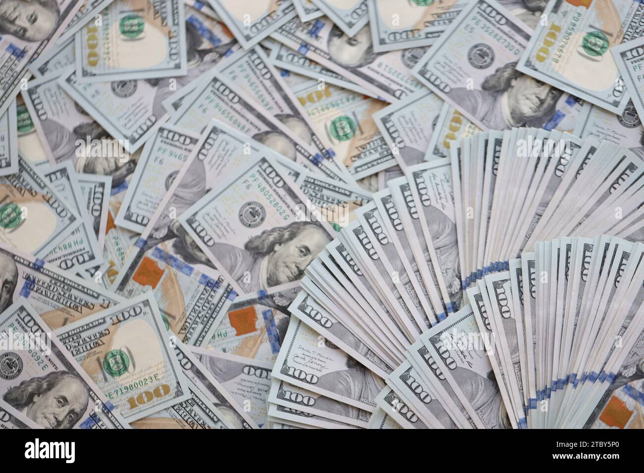 Very big amount of US hundred dollar bills close up. Huge quantity of ...