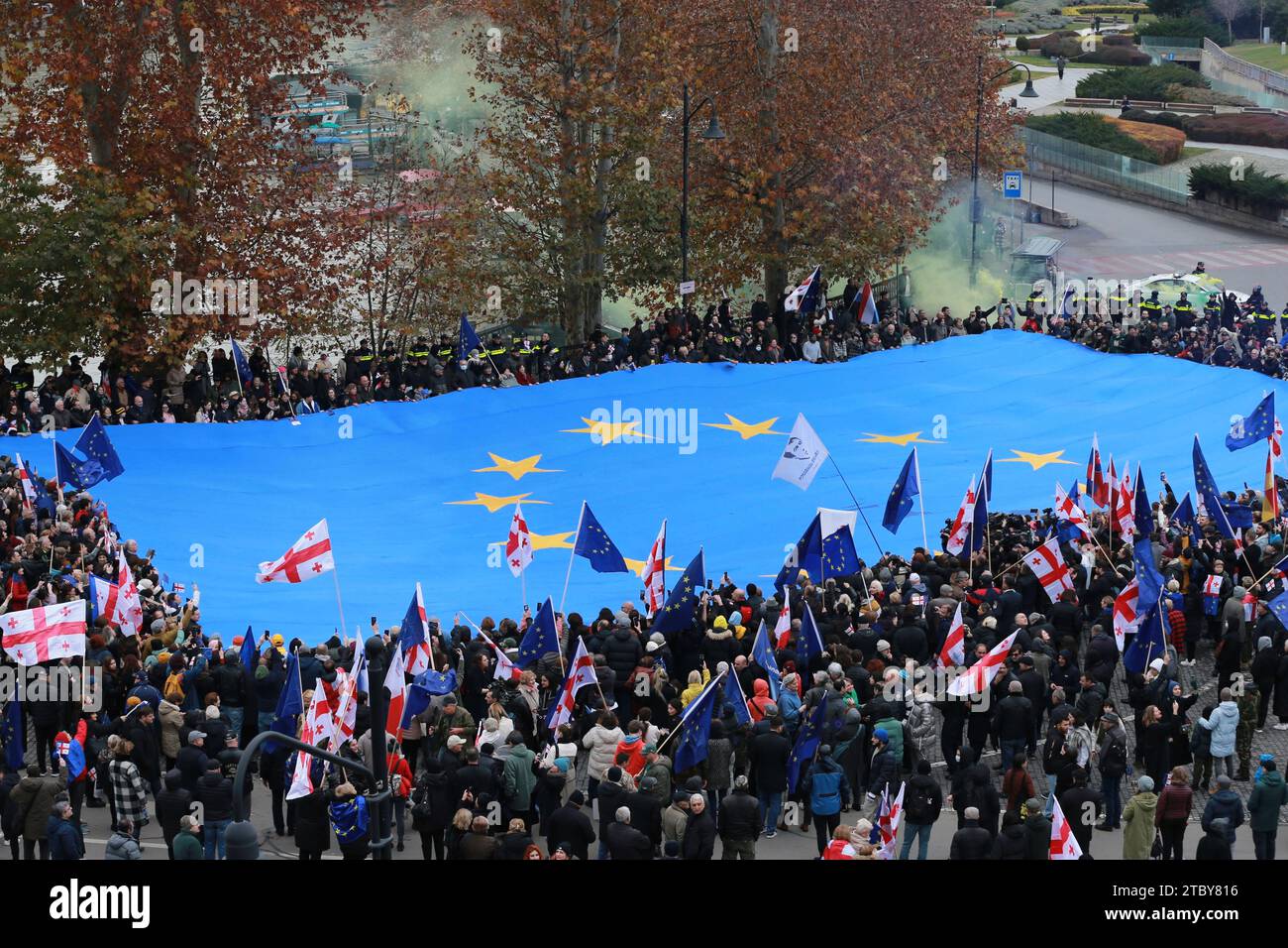 Demonstrators carry a gigantic EU flag during a march in support of ...