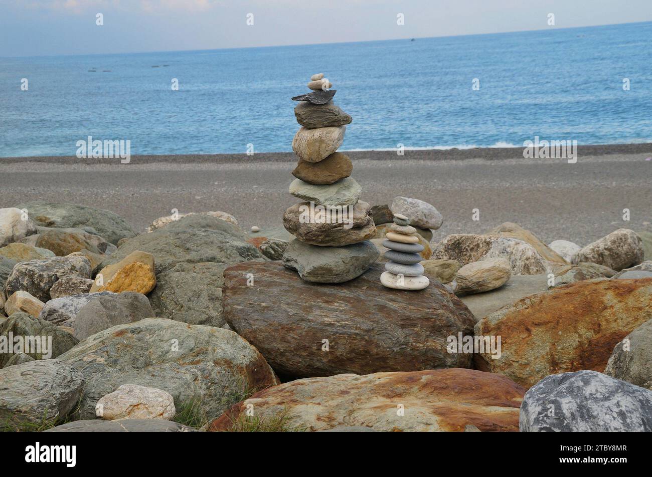 Stones piles on the beach Stock Photo - Alamy