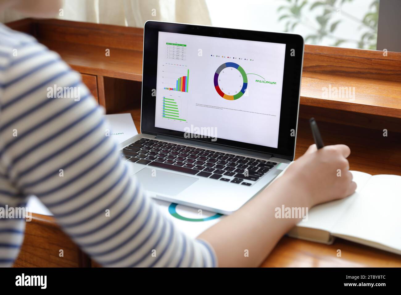 A woman using computer prepare financial graph diagram Stock Photo - Alamy