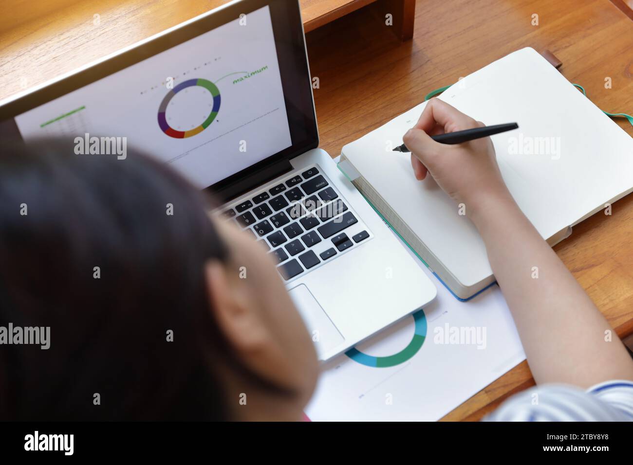 A woman using computer prepare financial graph diagram Stock Photo - Alamy
