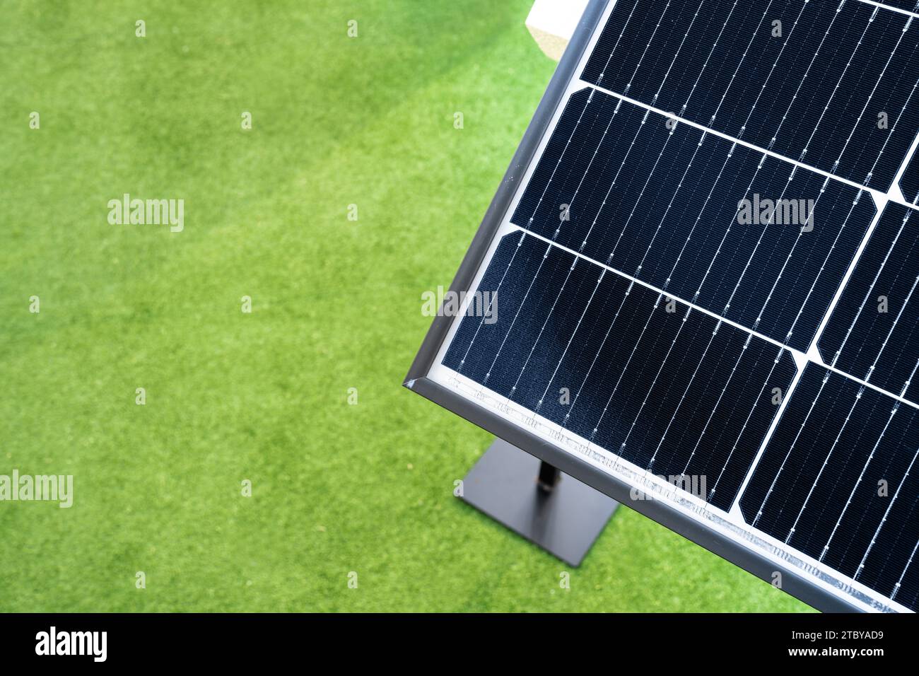 Solar panel on a background of green grass Stock Photo - Alamy