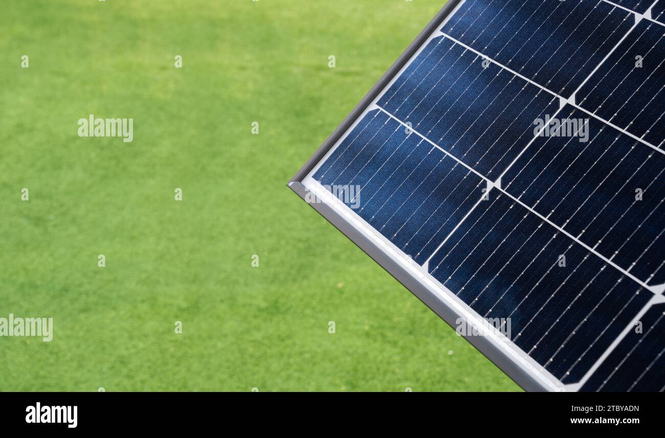 Solar panel on a background of green grass Stock Photo - Alamy