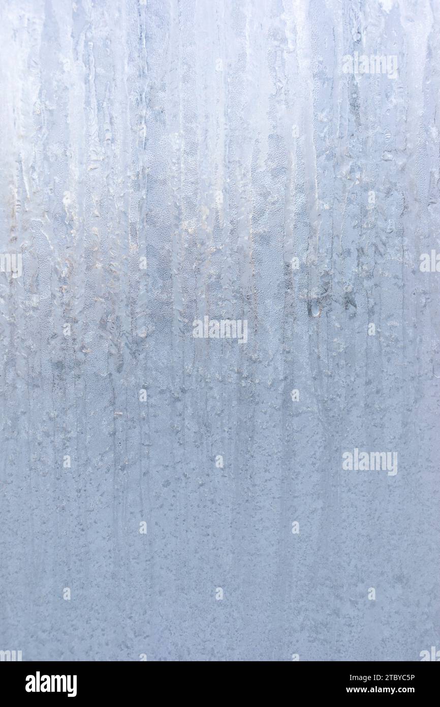 Frosty winter striped pattern on winter window glass. Window with ...