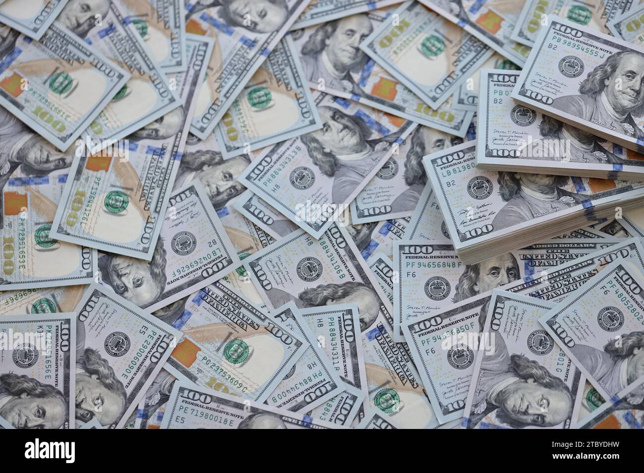 Very big amount of US hundred dollar bills close up. Huge quantity of ...