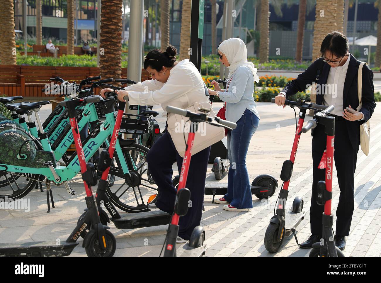 Dubai, United Arab Emirates (UAE). 8th Dec, 2023. People scan QR code ...