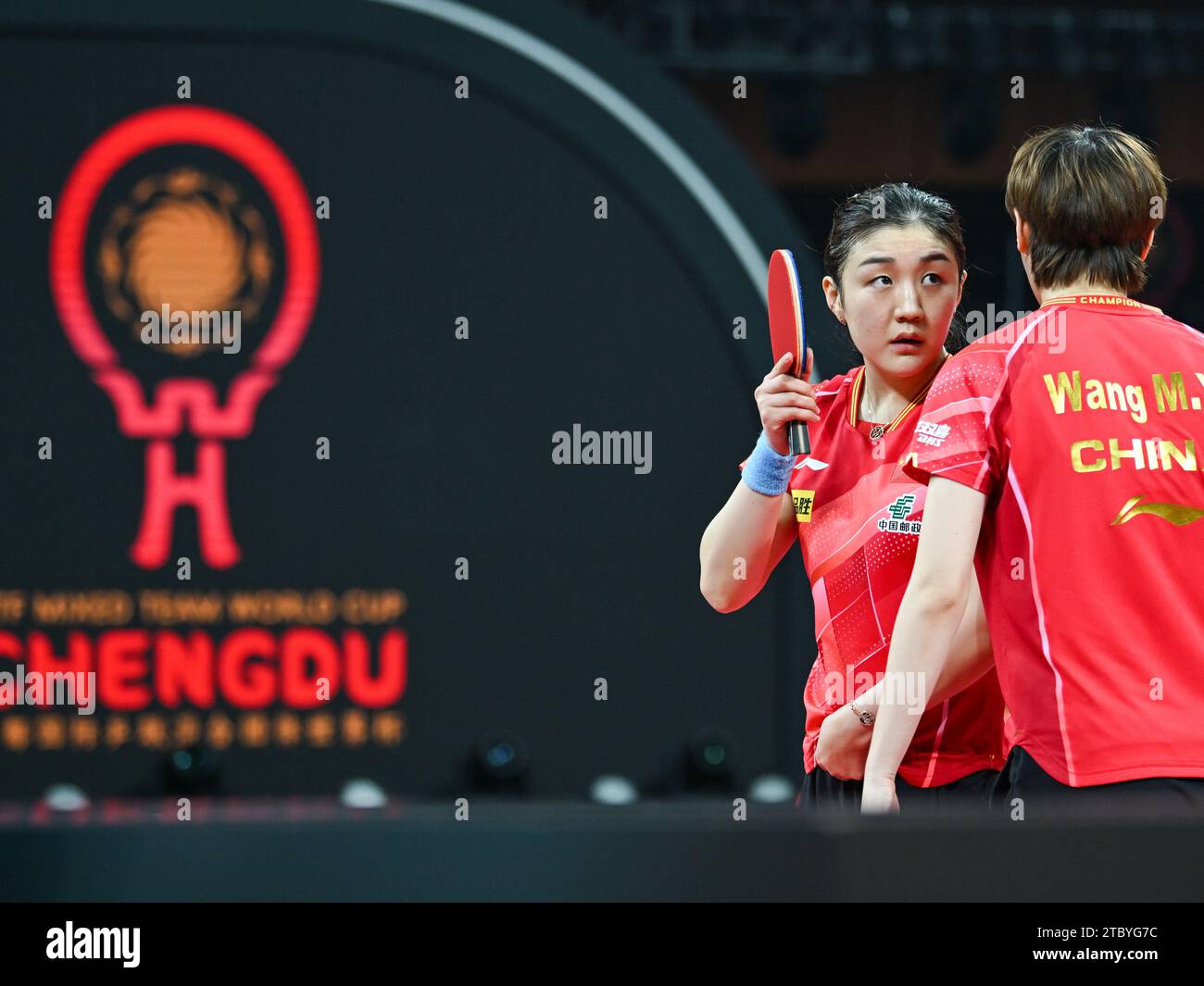 Chengdu, China's Sichuan Province. 9th Dec, 2023. Wang Manyu/Chen Meng (L) of China communicate ...