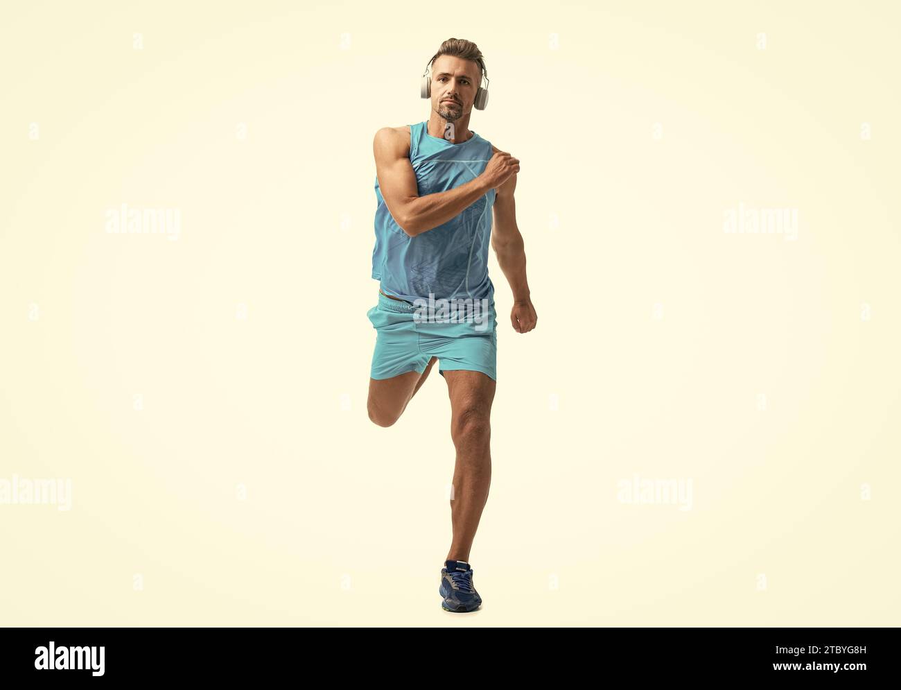 The front view of jogger ran at sport training isolated on white. In a ...