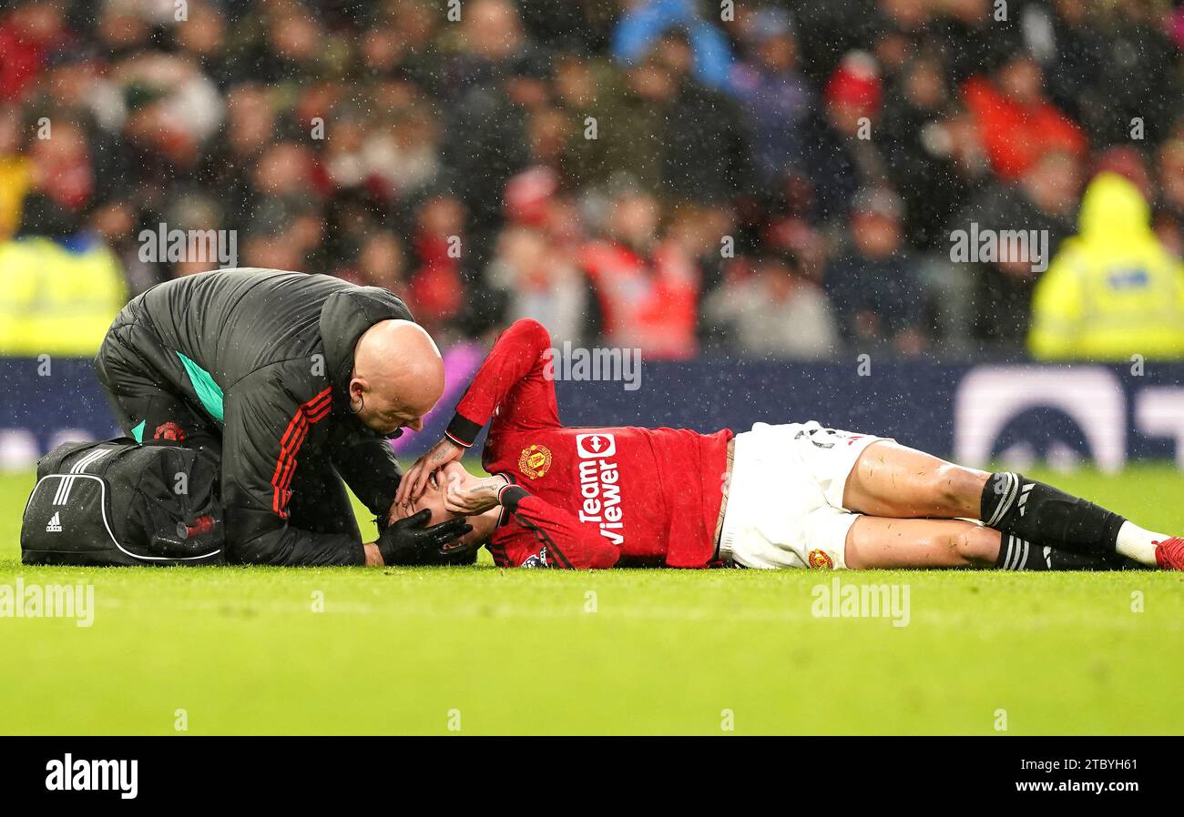 Manchester United's Alejandro Garnacho receives treatment for a ...