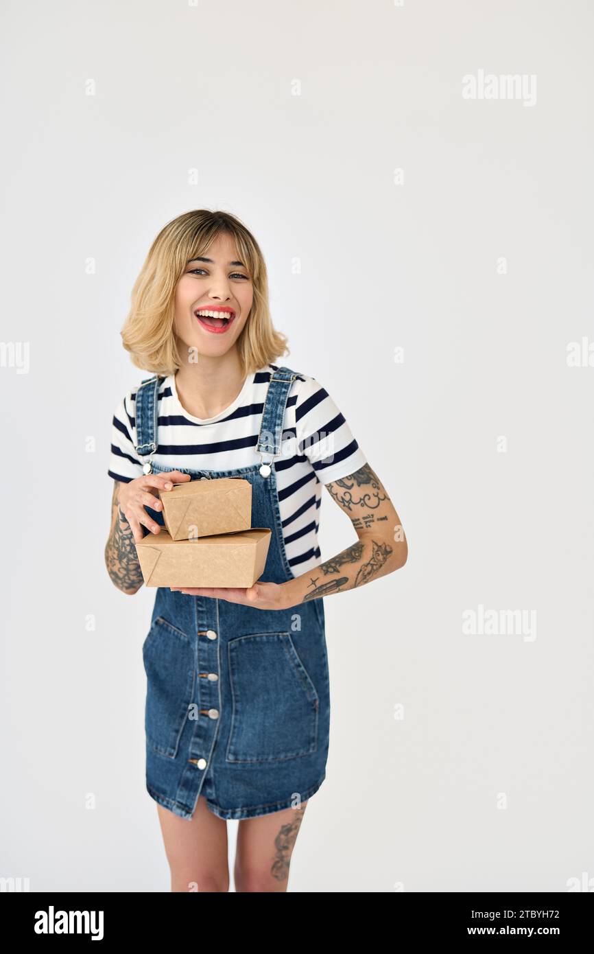 Happy young woman customer holding lunch boxes excited with fast food ...