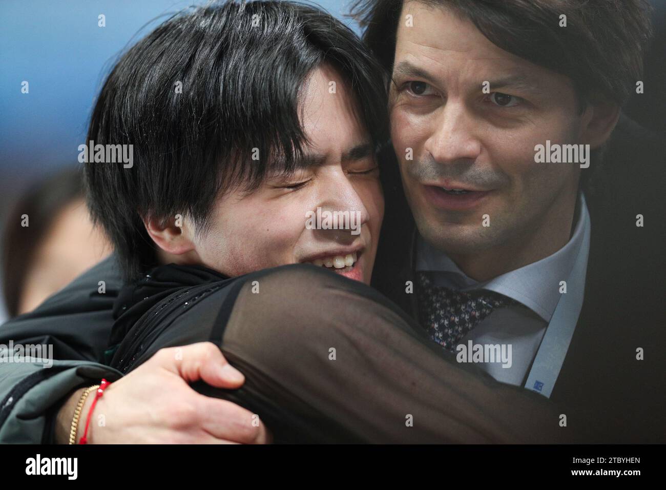 Beijing, China. 9th Dec, 2023. Uno Shoma (L) of Japan reacts after the men's free skating at the ...