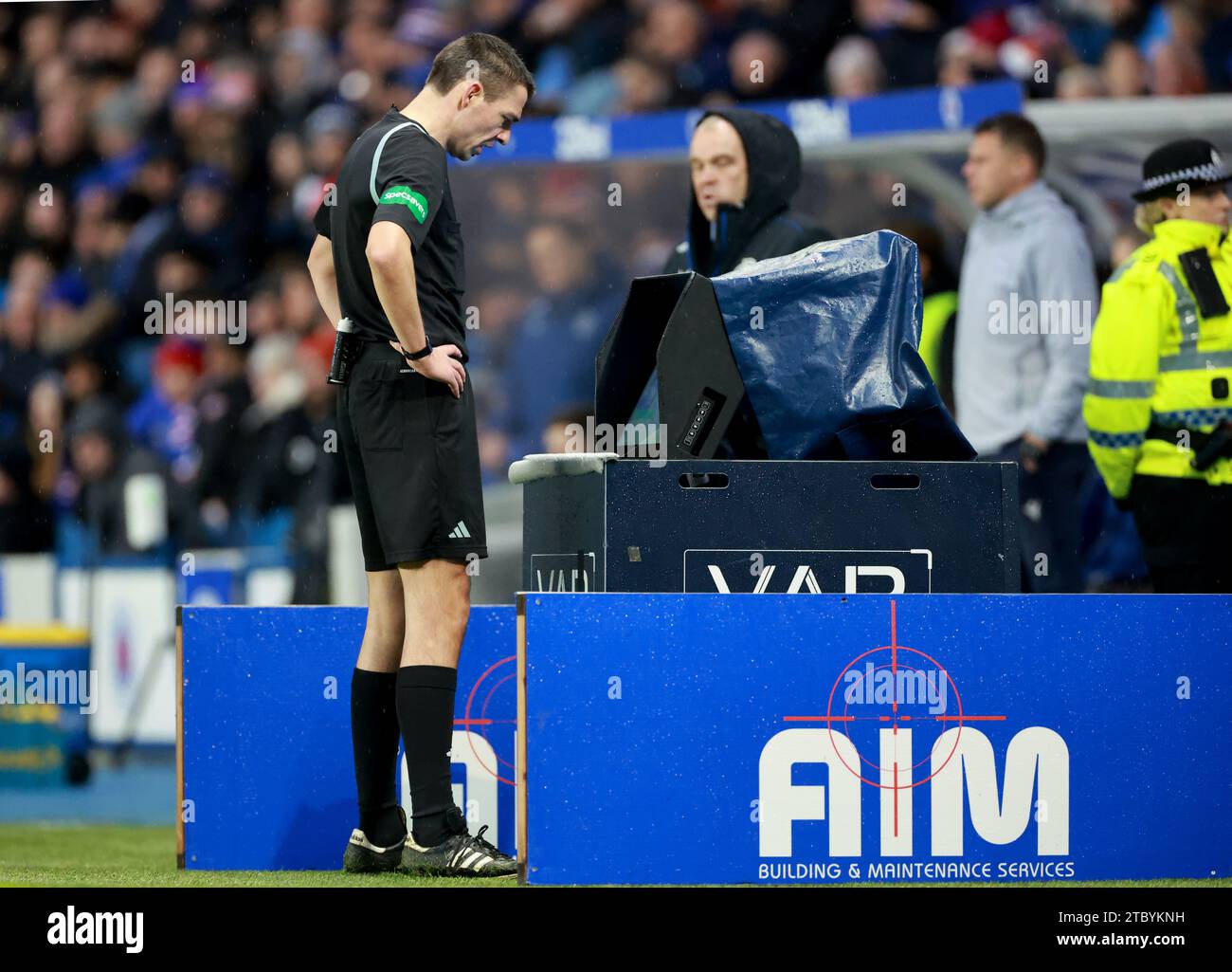 Referee Kevin Clancy views video evidence on the VAR screen, shortly ...