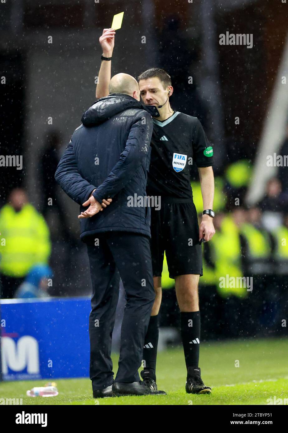 Rangers manager Philippe Clement (left) is shown a yellow card by ...