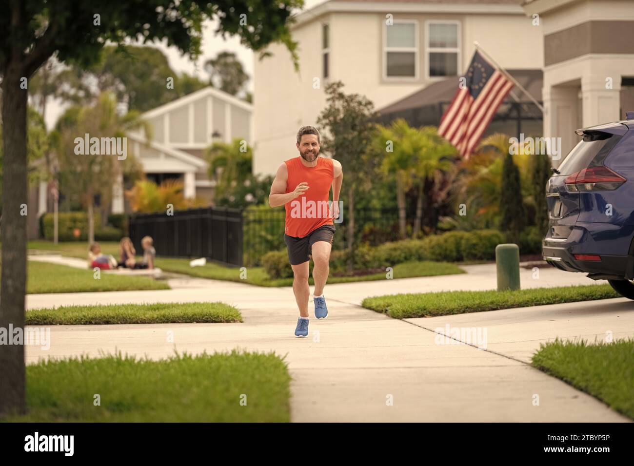 sport fit man jogging outdoor. The running man races down the ...