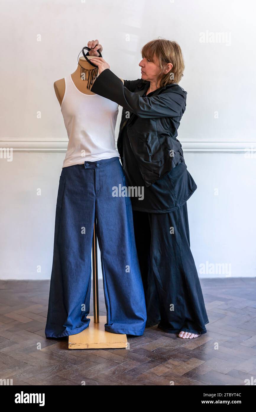 Fashion designer dressing a mannequin Stock Photo - Alamy