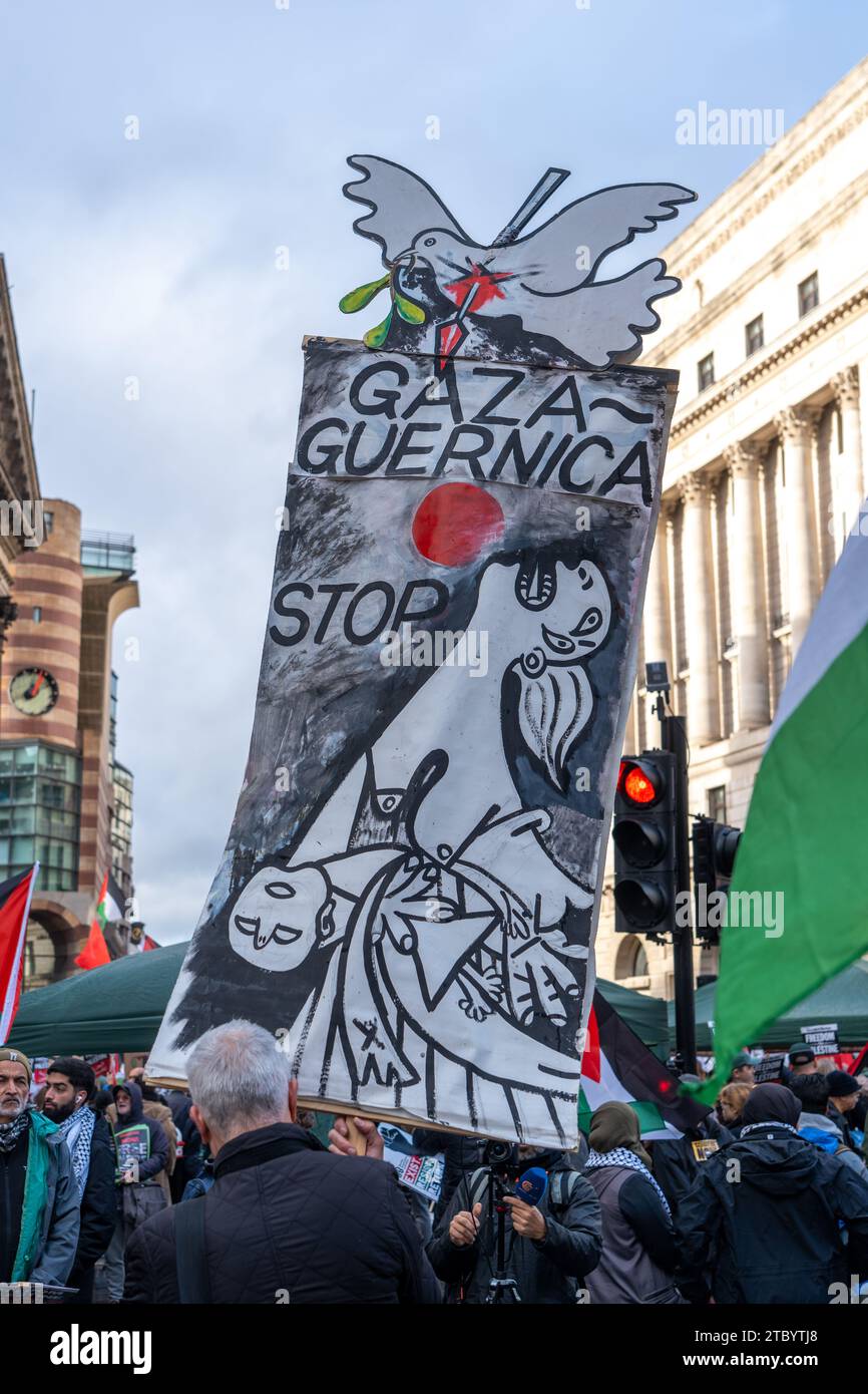 London, UK. Saturday, 9 December, 2023. A placard comparing Gaza and ...