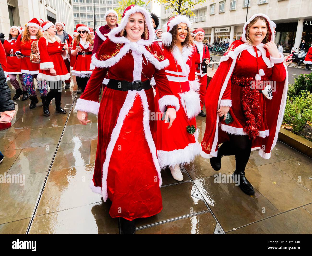 London, UK. 9th Dec, 2023. The Santacon Christmas walk in London. An ...