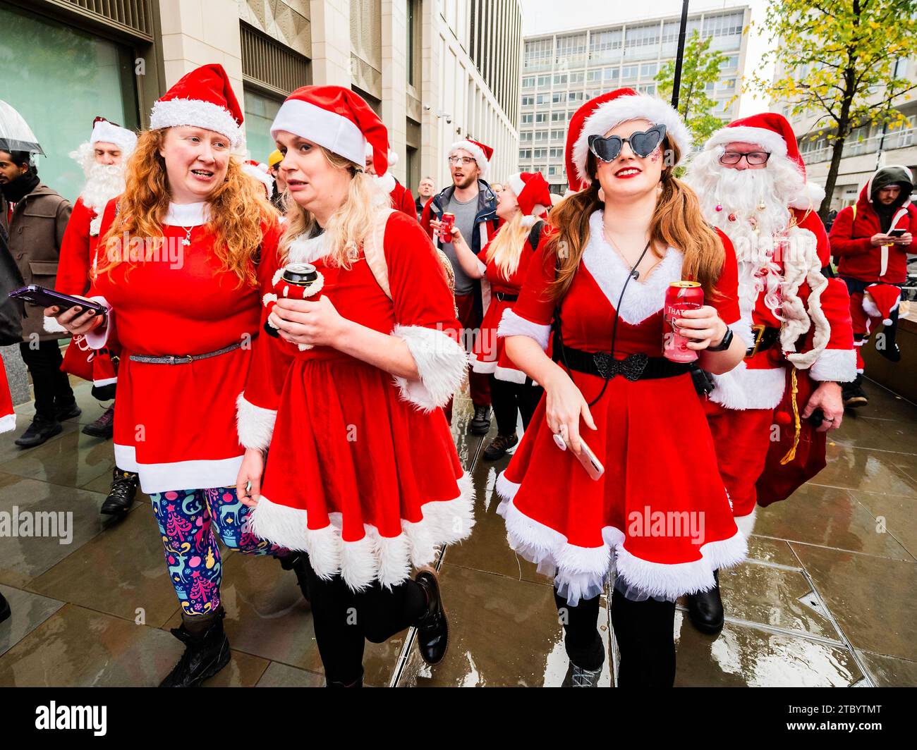 London, UK. 9th Dec, 2023. The Santacon Christmas walk in London. An ...