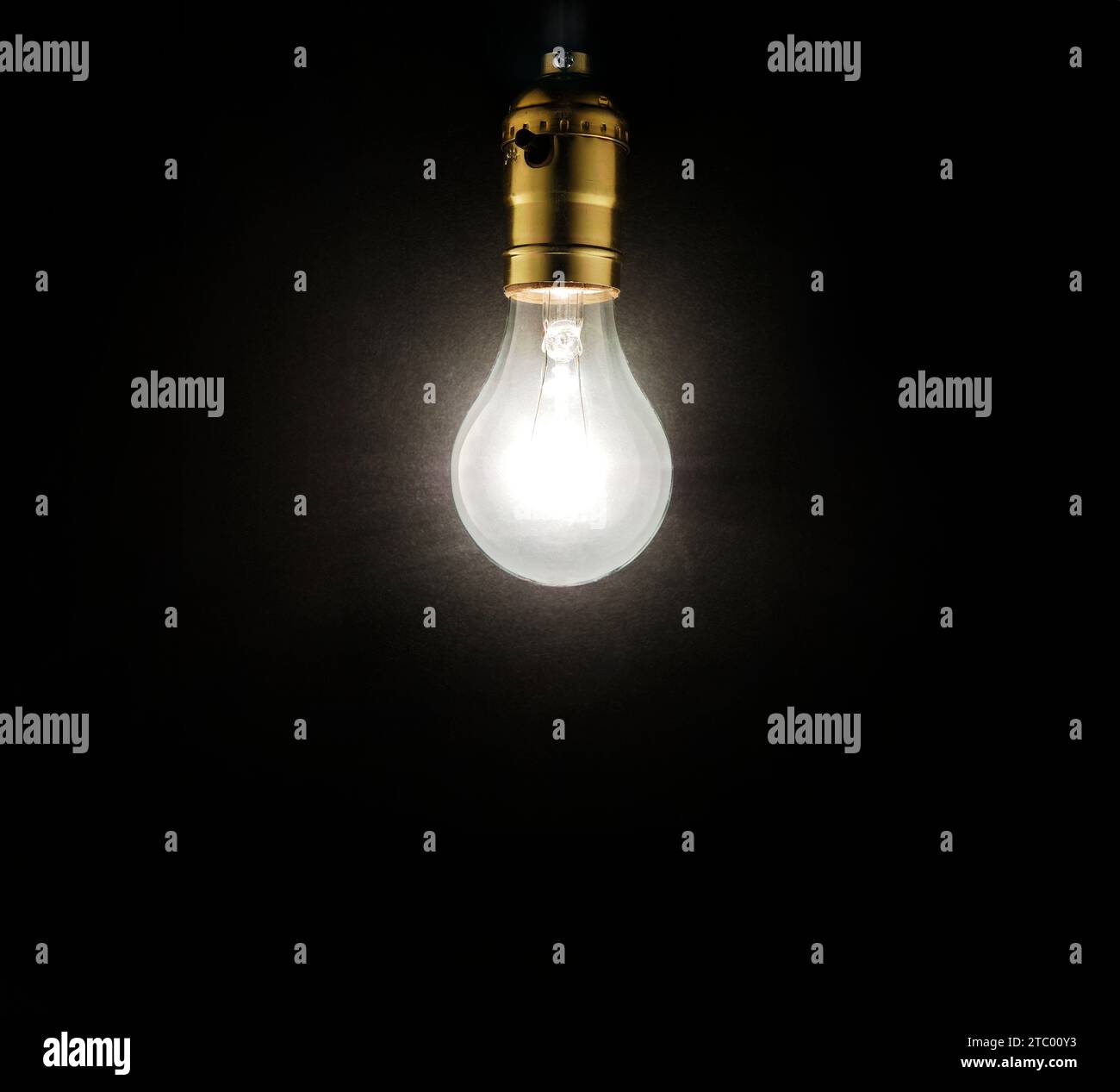 A light bulb on a black background Stock Photo - Alamy