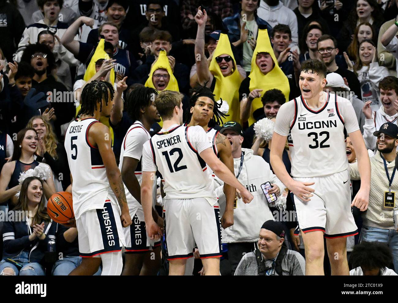 UConn guard Cam Spencer (12) chest bumps teammate UConn guard Solomon ...