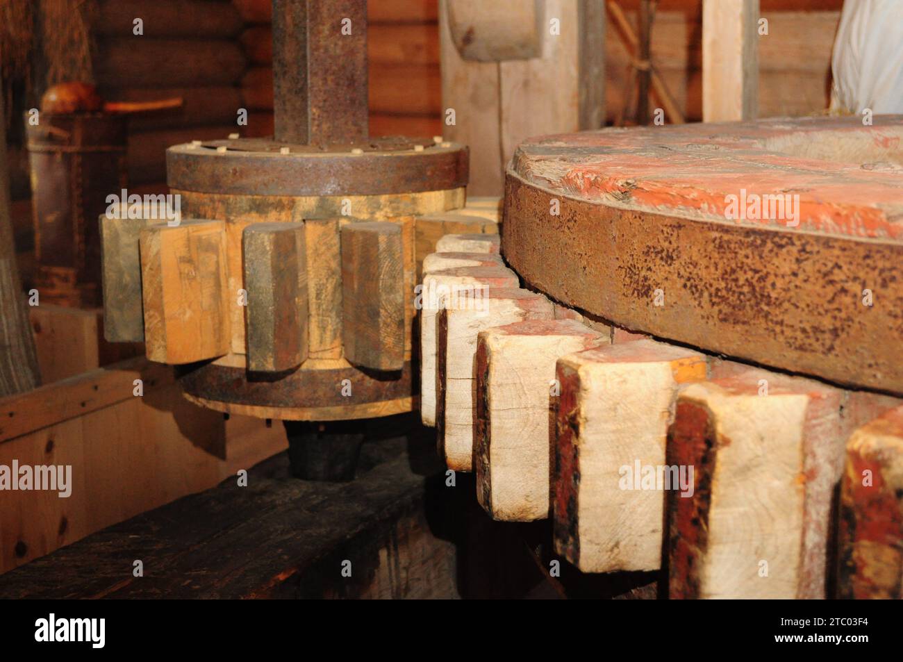 The interior of the old wooden mill with a millstone. Arkhangelsk ...