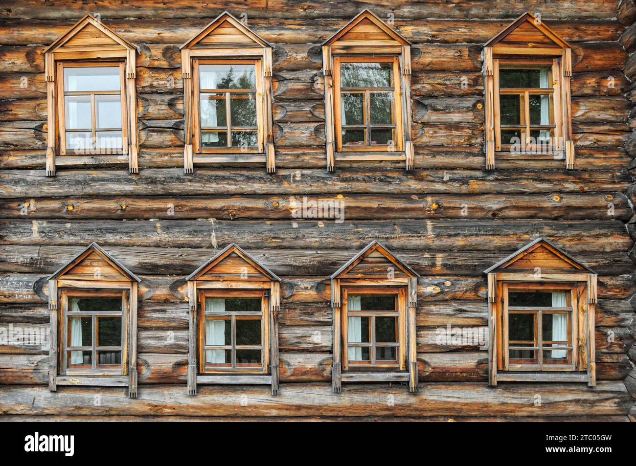 Eight vintage wooden windows in russian national style Stock Photo - Alamy